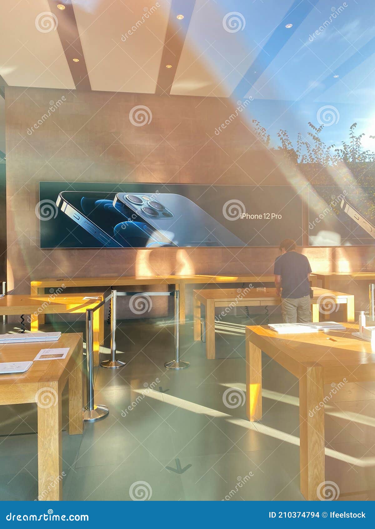 View from the Showcase at Empty Tables of Apple Store with No Customers ...