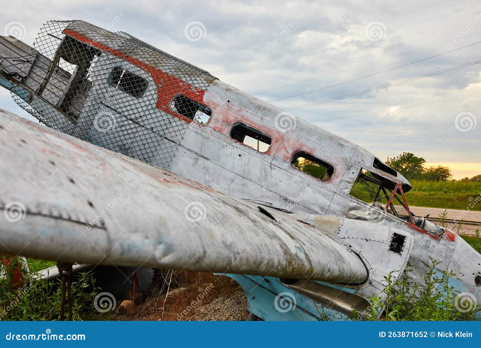 View from Side of Crashed Airplane Setting in Field with Dusk Light ...