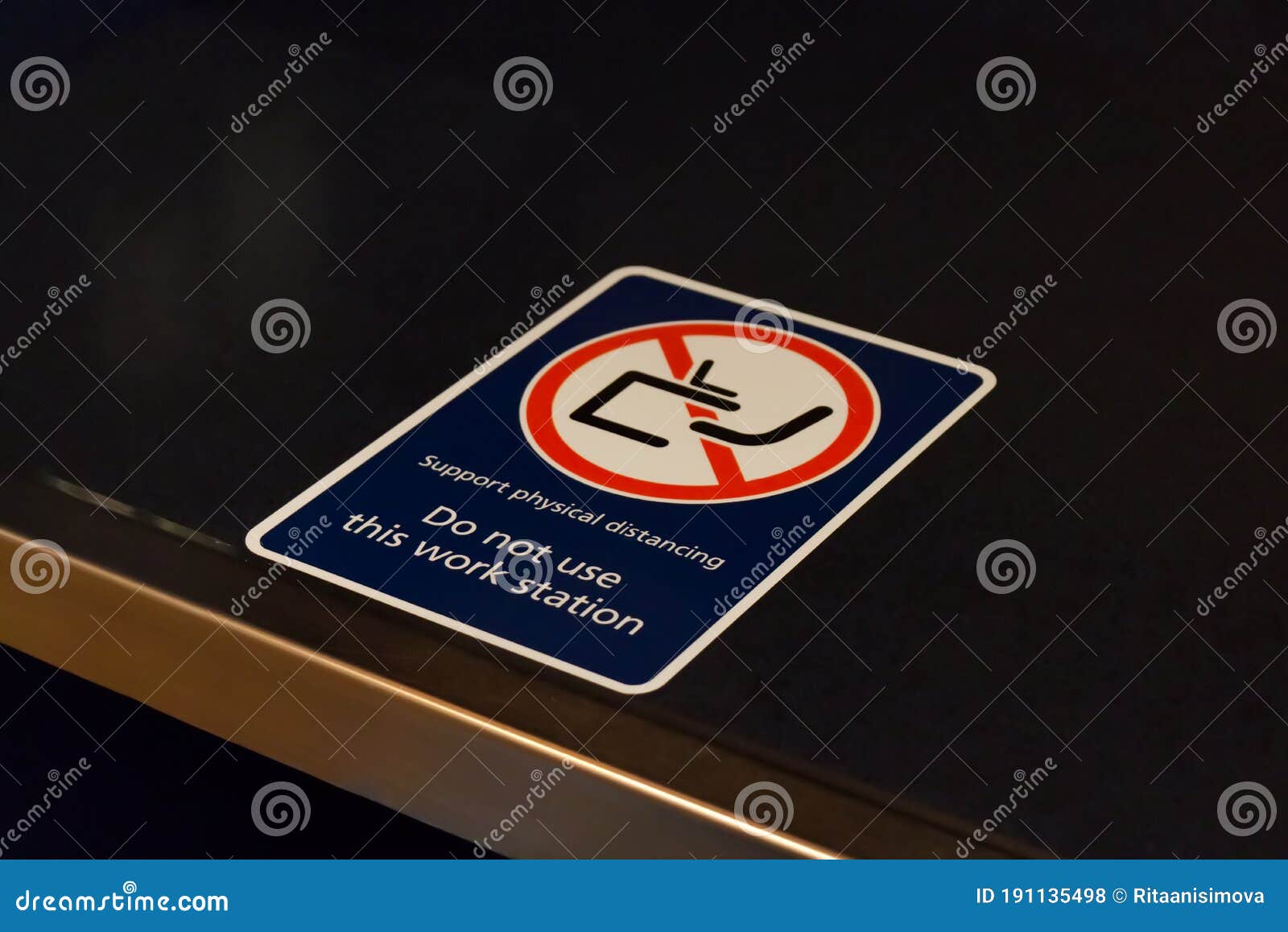 View of Sign `Support Physical Distancing. Do Not Use this Workstation ...