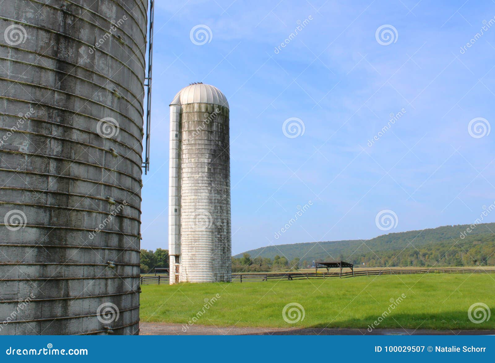 View of a Silo in the Distance with a Portion of a Silo To the Left ...