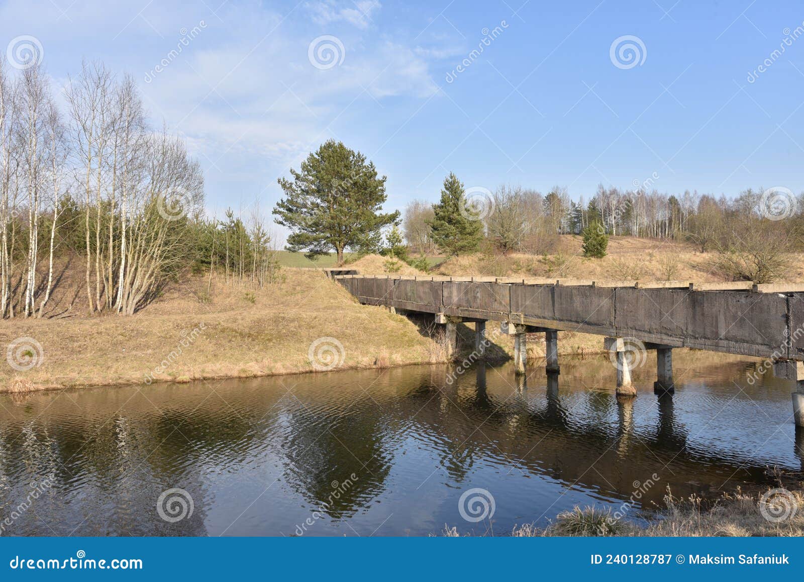 View of a Small River with a Bridge in Spring. Channel of the Vileyka ...