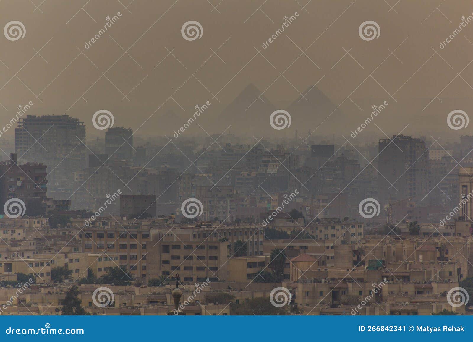 View of Smoggy Cairo Skyline with Pyramids in the Background, Egy Stock ...