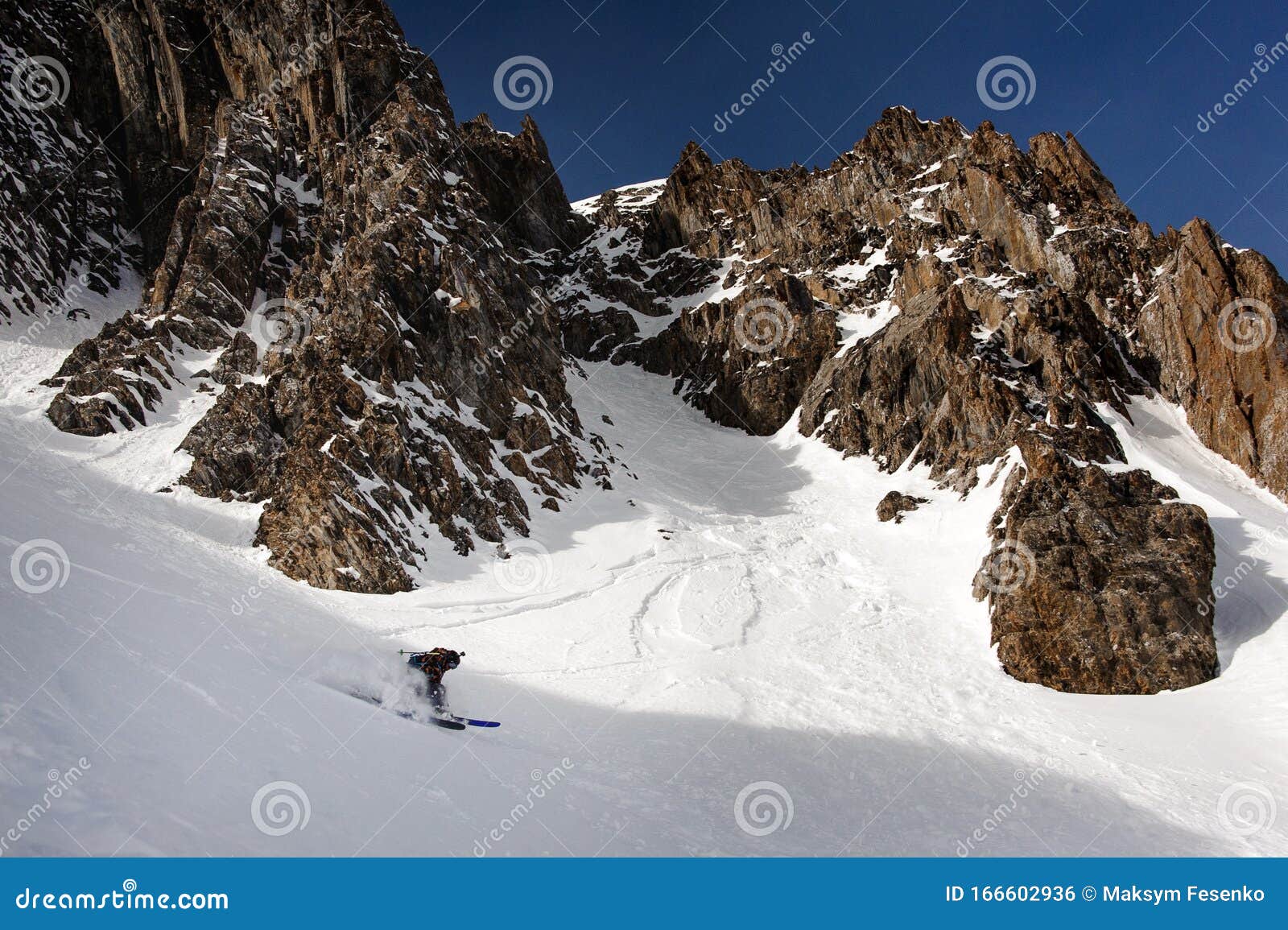 View of Snowboarder Sliding Down the Mountain Side Stock Photo - Image ...