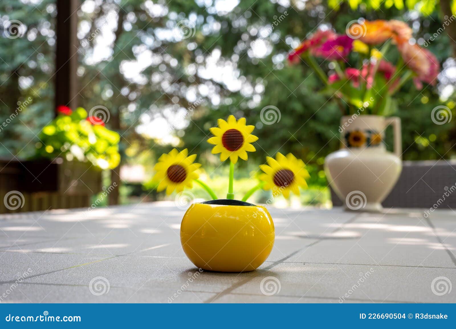 View on a Solar Powered Plastic Artificial Sunflower Moving by the ...