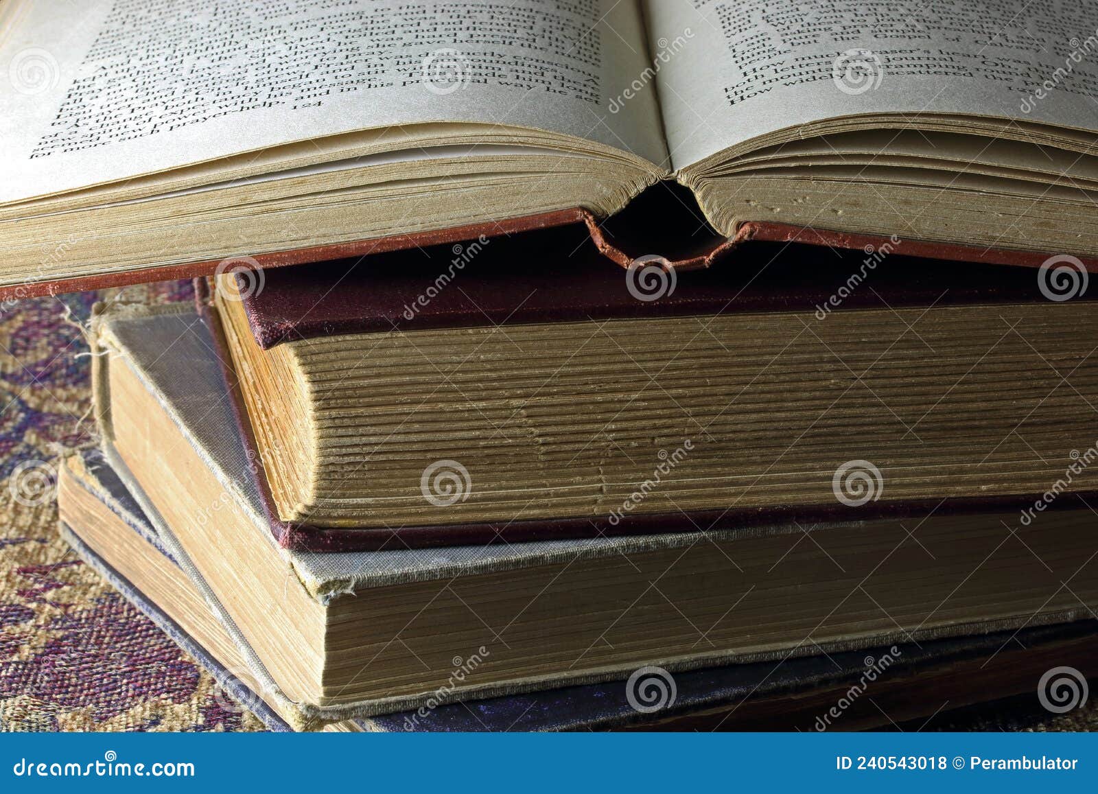 A STACK of OLD BOOKS with an OPEN BOOK on TOP Editorial Stock Photo ...