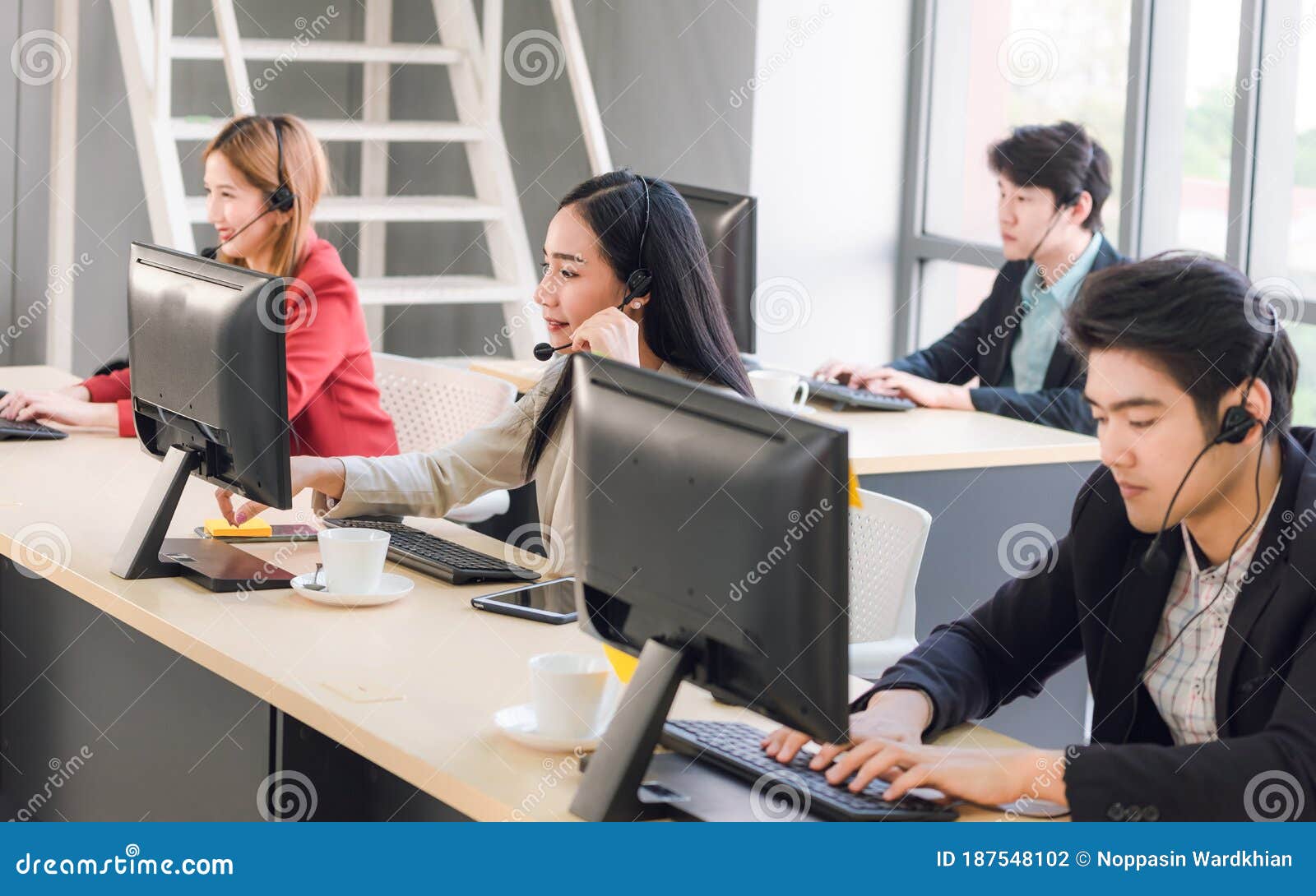 View of Staff in Busy Customer Service Department Stock Photo - Image ...