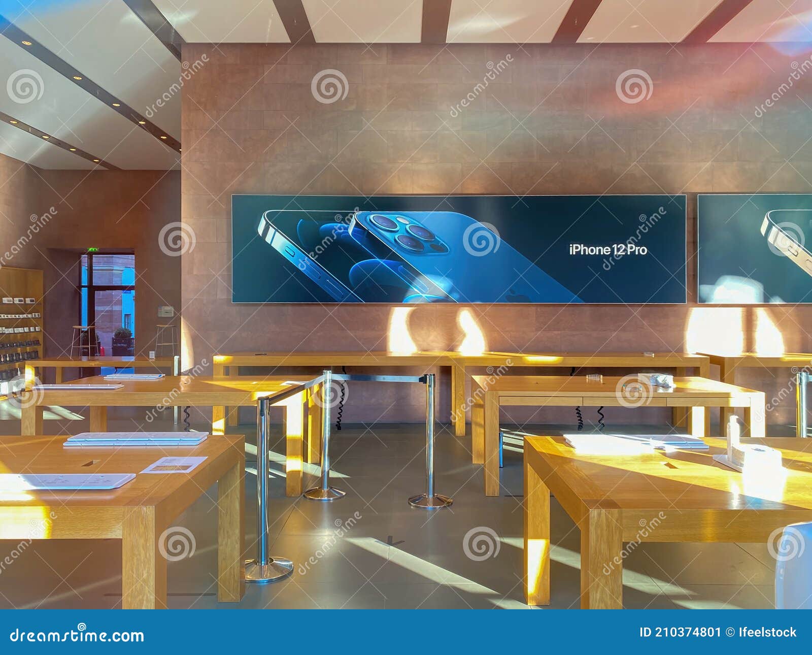 View from the Street at the Empty Wooden Tables Inside Apple Computers ...