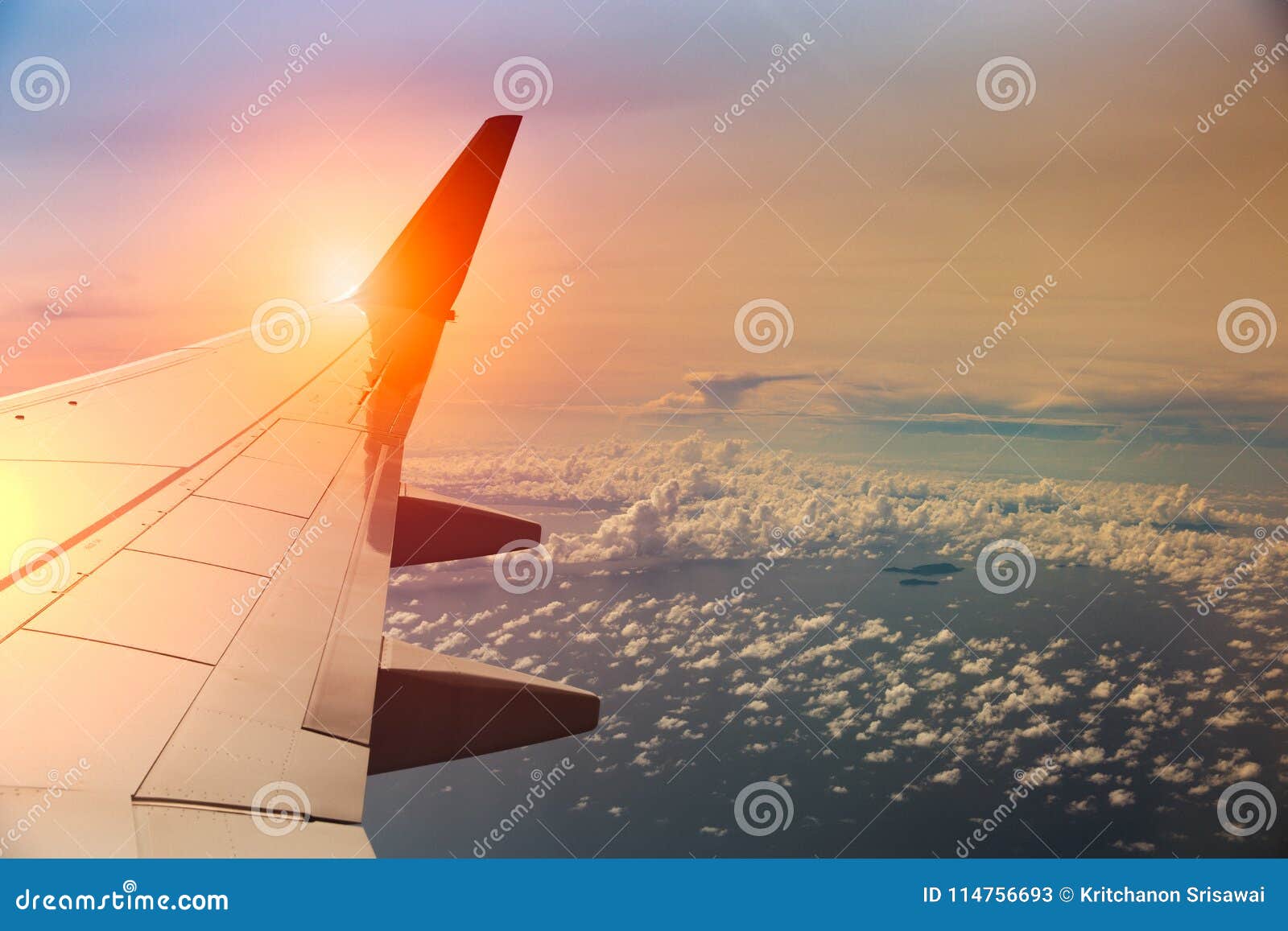 View on the Sunset and Airplane Wing from the Inside. Stock Image ...