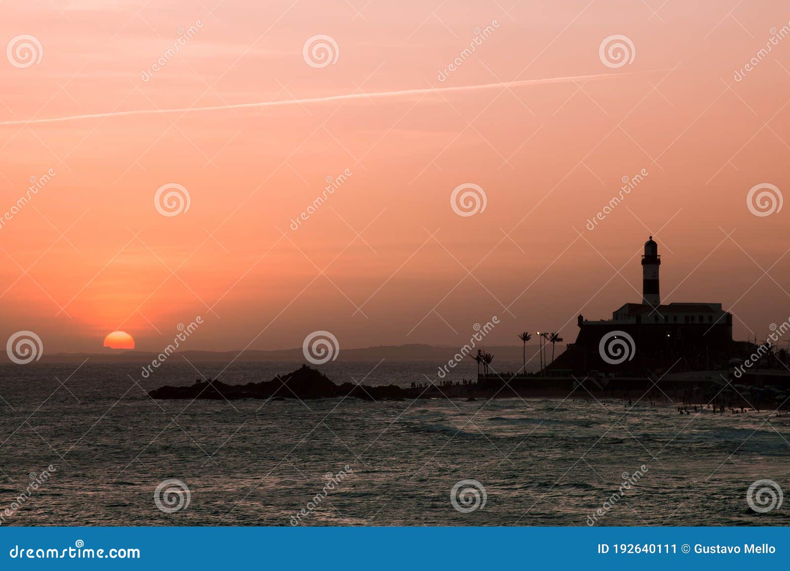 View of the Sunset on the Beach Bar with the Barra Lighthouse in the ...