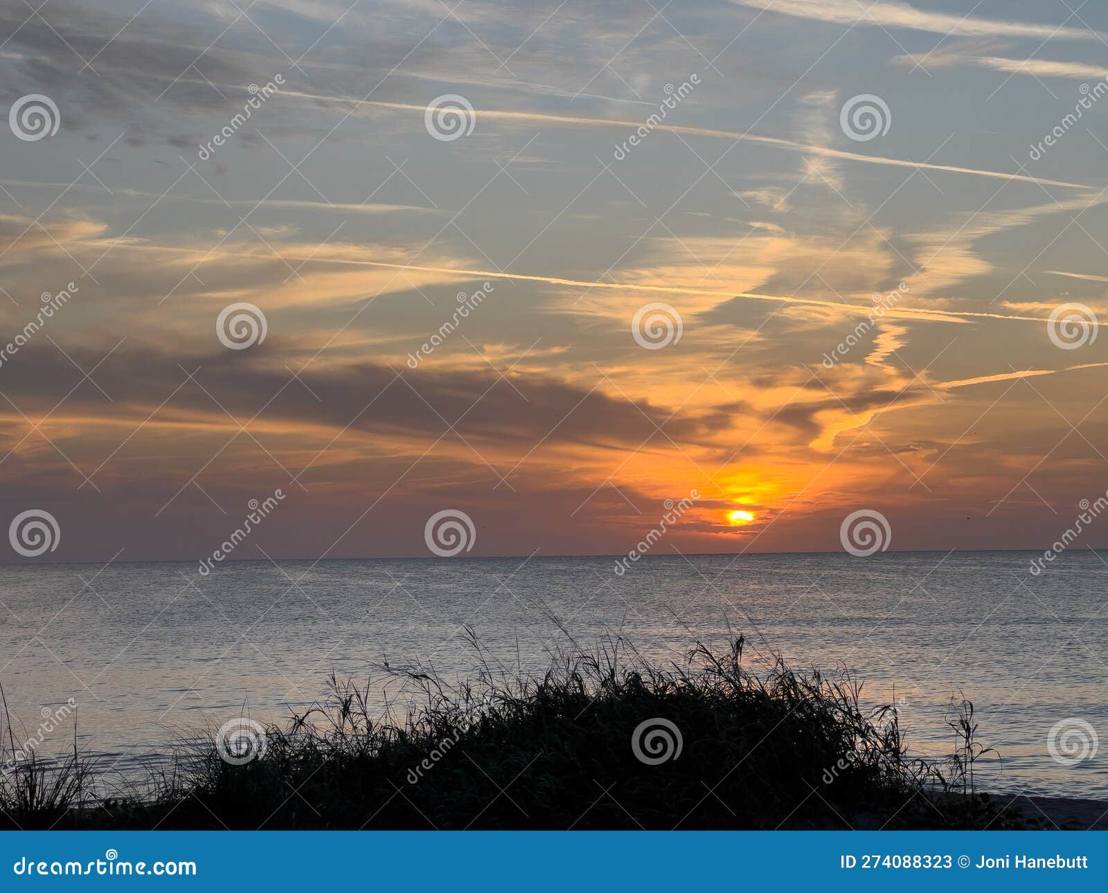 A View of a Sunset on the Beach at Siesta Key, Florida with a Blue ...