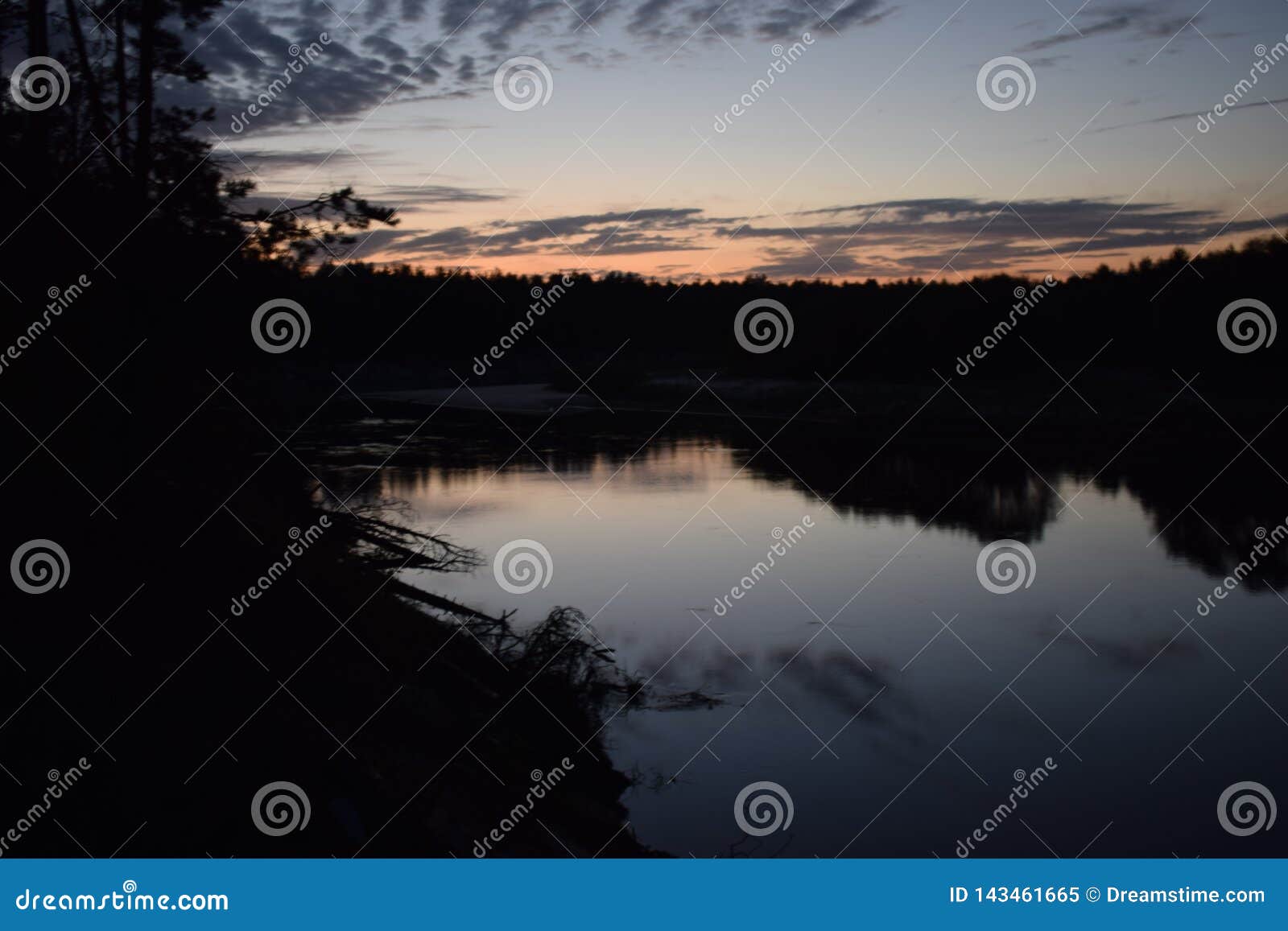 The View of the Sunset on the Forest River with Reflection of the Cloud ...