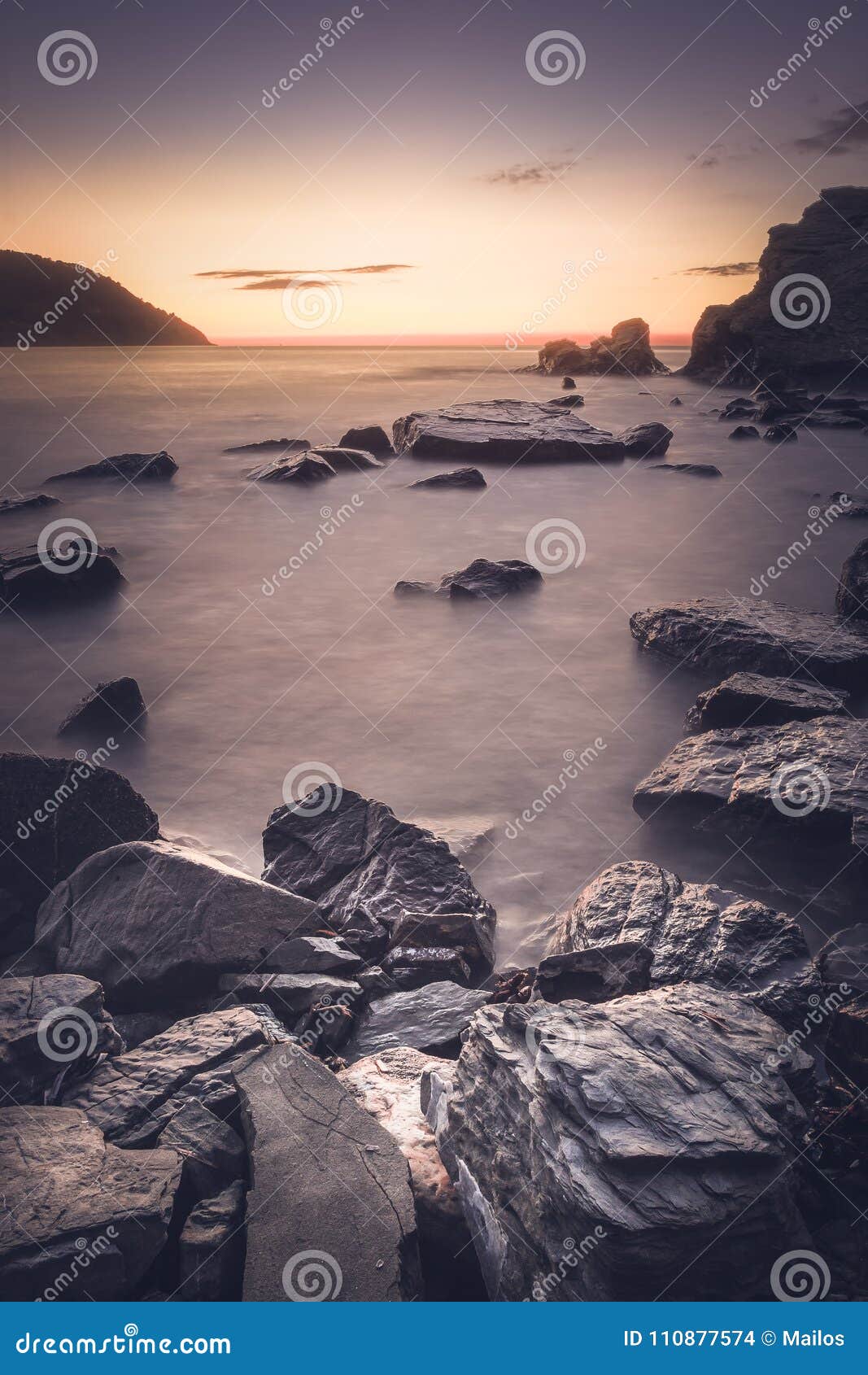 View of a Sunset and in the Foreground of the Rocks Stock Photo - Image ...
