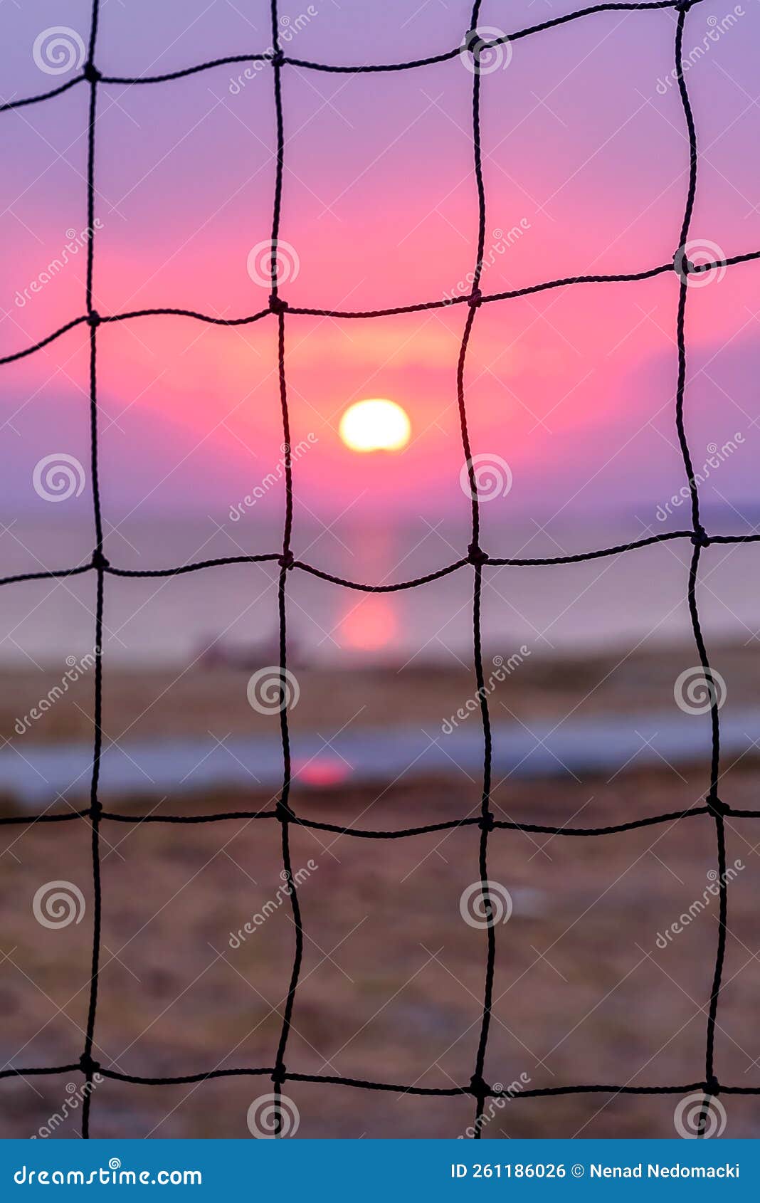 View of the Sunset through the Volleyball Net. Dramatic Sunset Over Sea ...