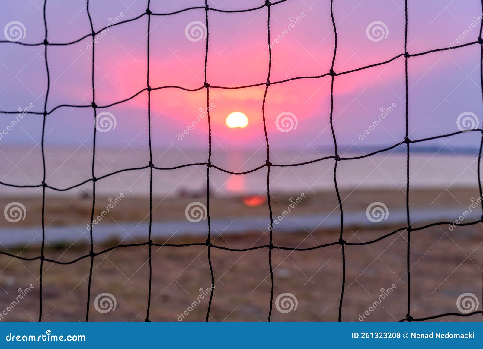 View of the Sunset through the Volleyball Net. Dramatic Sunset Over Sea ...