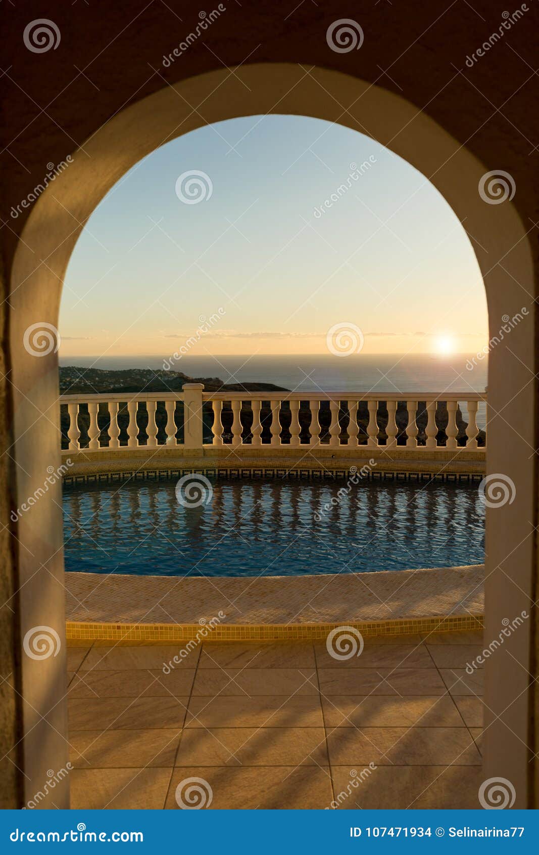 View of the Swimming Pool through the Arch at Sunset. Stock Photo ...