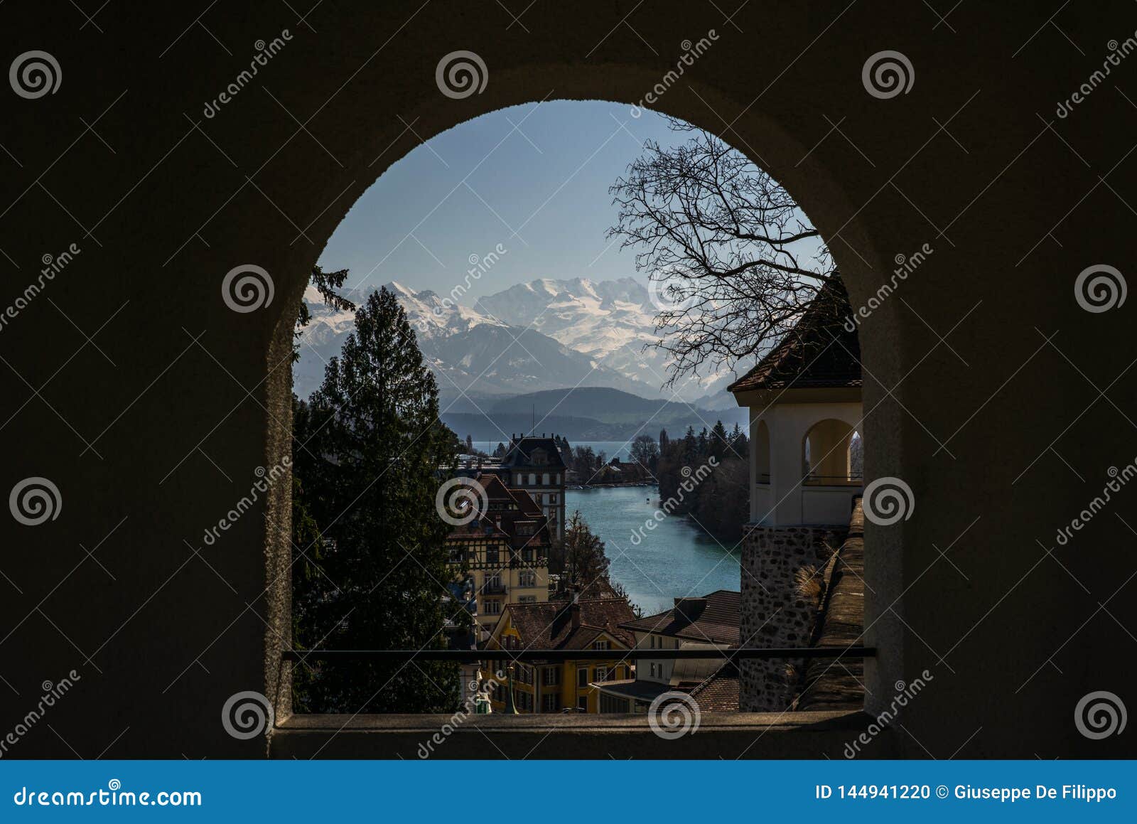 View of the Swiss Alps through a Window in Spring in the Swiss Town of ...