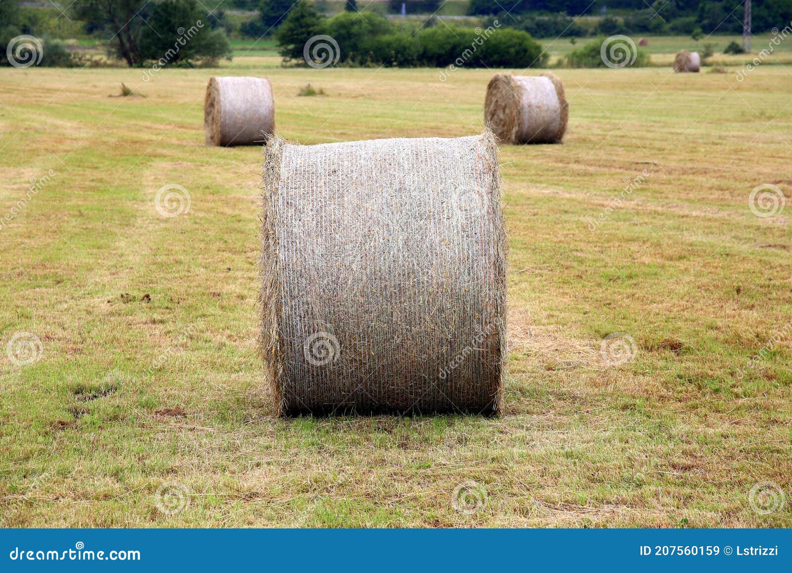 Three Bales of Hay in the Mountain Fields Stock Image - Image of hills ...