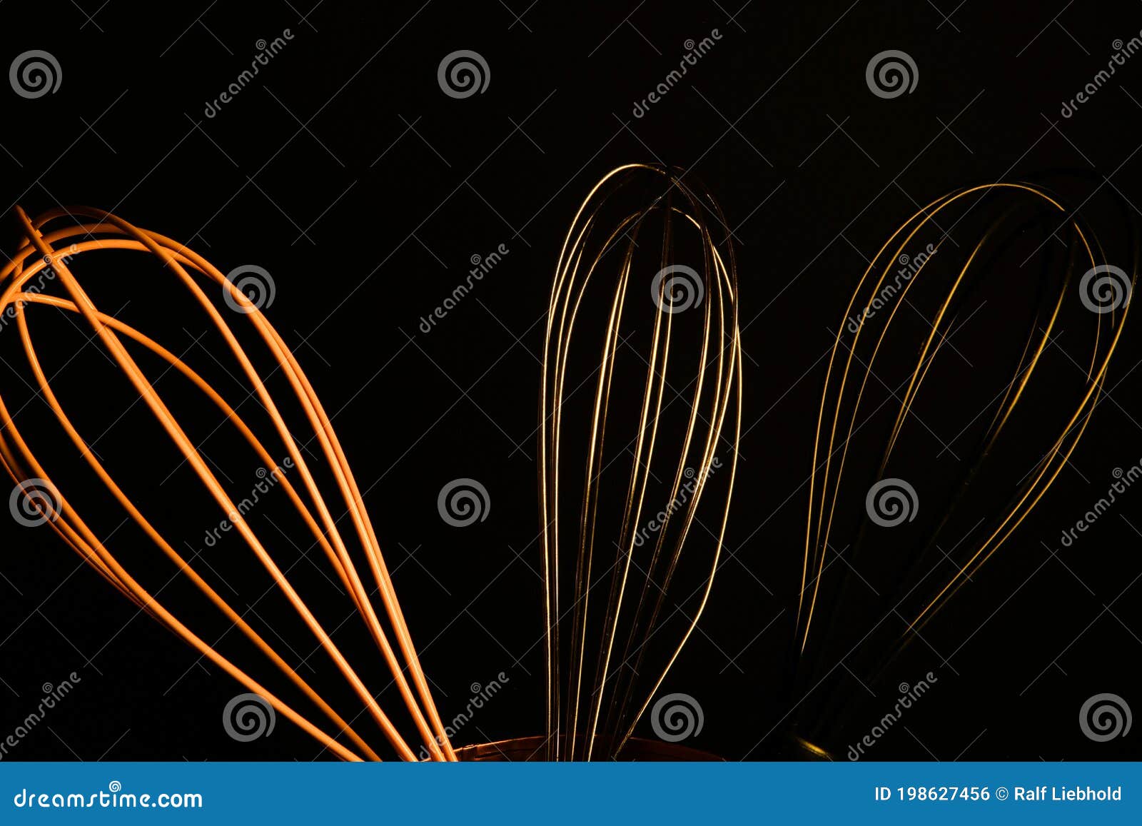 View on Three Isolated Shiny Wire Whisk Loops, Black Background Focus ...