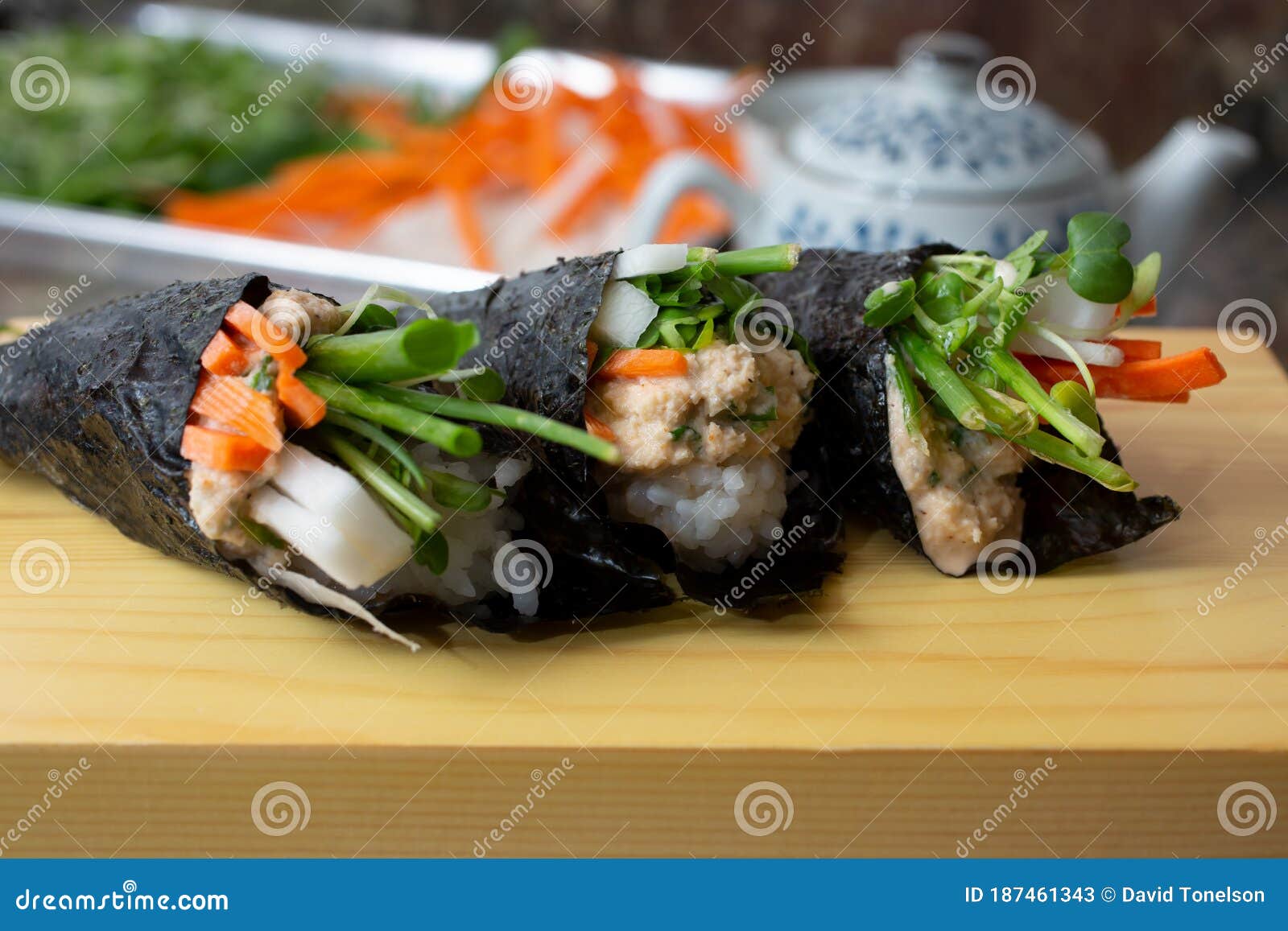 Three temaki on board stock image. Image of napkin, daikon - 187461343