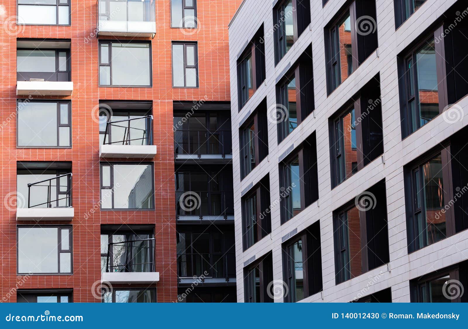 View on New Construction Brick Apartment Complex Square Windows. Modern ...