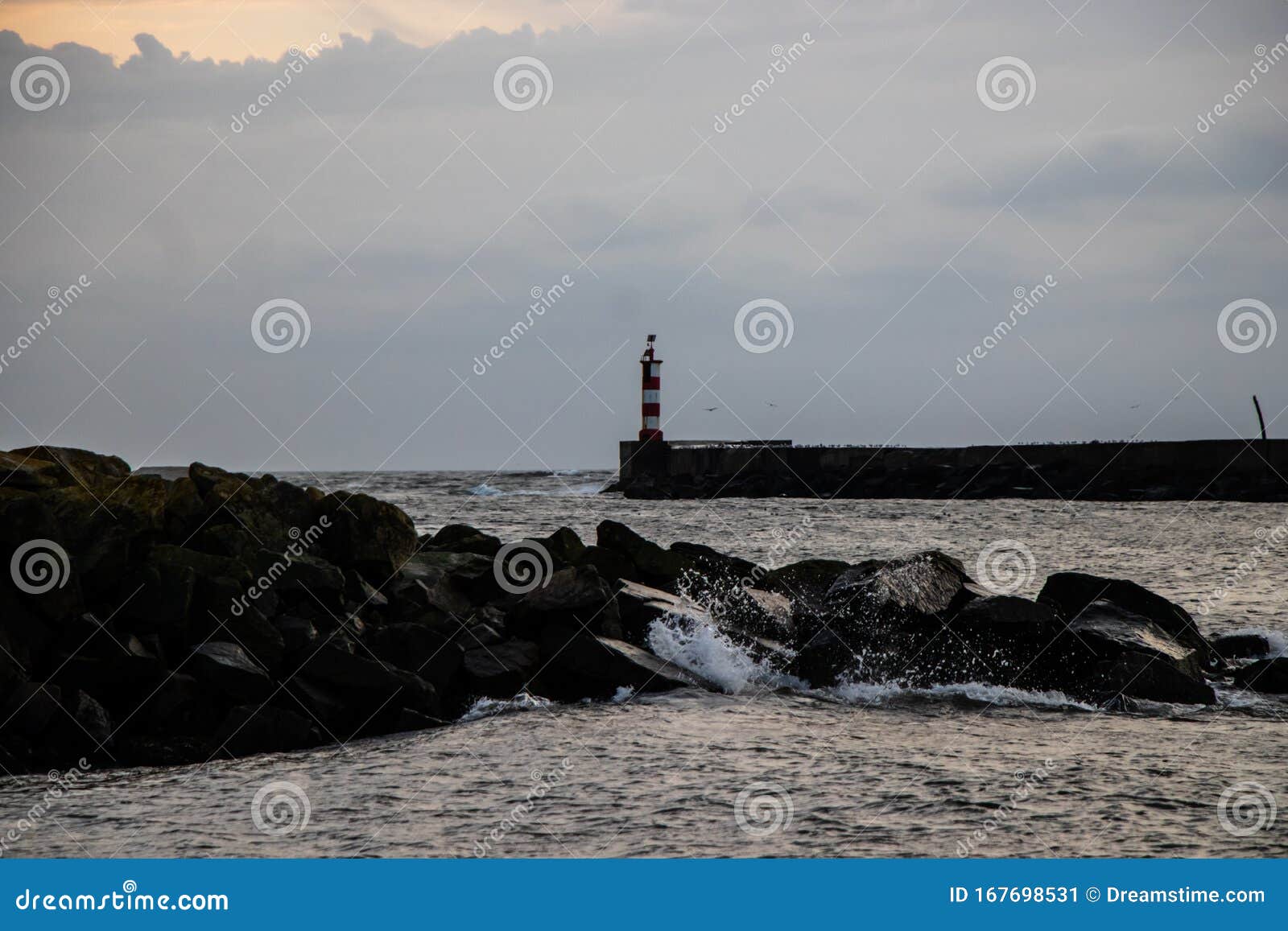 View To a Lighthouse in a Cloudy Winter Day Stock Image - Image of ...