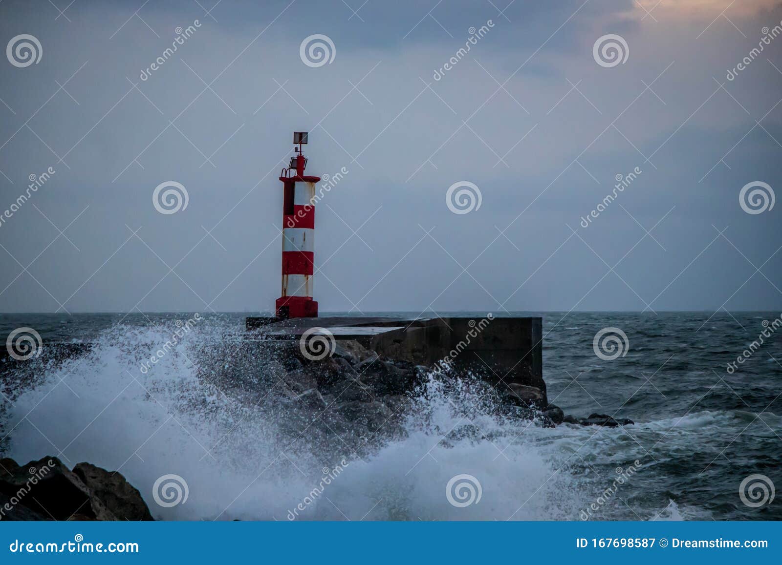 View To a Lighthouse in a Cloudy Winter Day Stock Image - Image of pier ...
