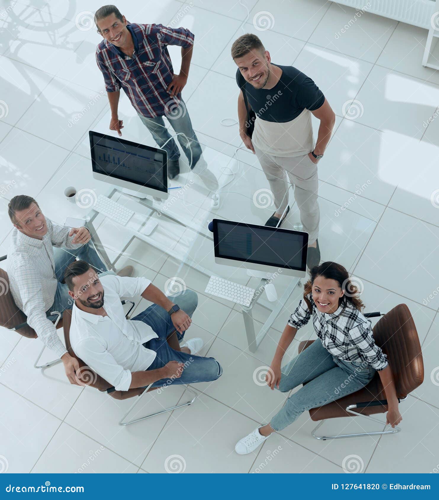 View the Top Creative Team Sitting Behind a Desk Stock Photo - Image of ...