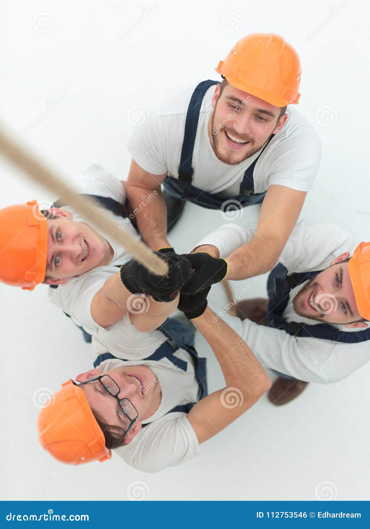 View from the Top.a Group of Workers Pulling a Rope Stock Photo - Image ...