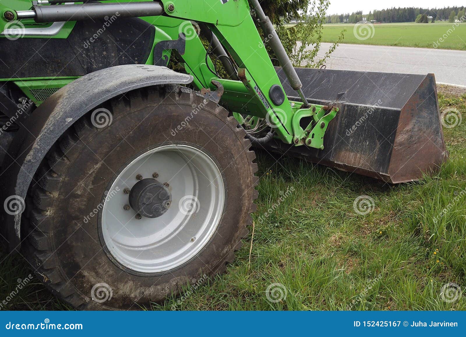 View of Tractor Front Wheel and Front End Loader Stock Image - Image of ...