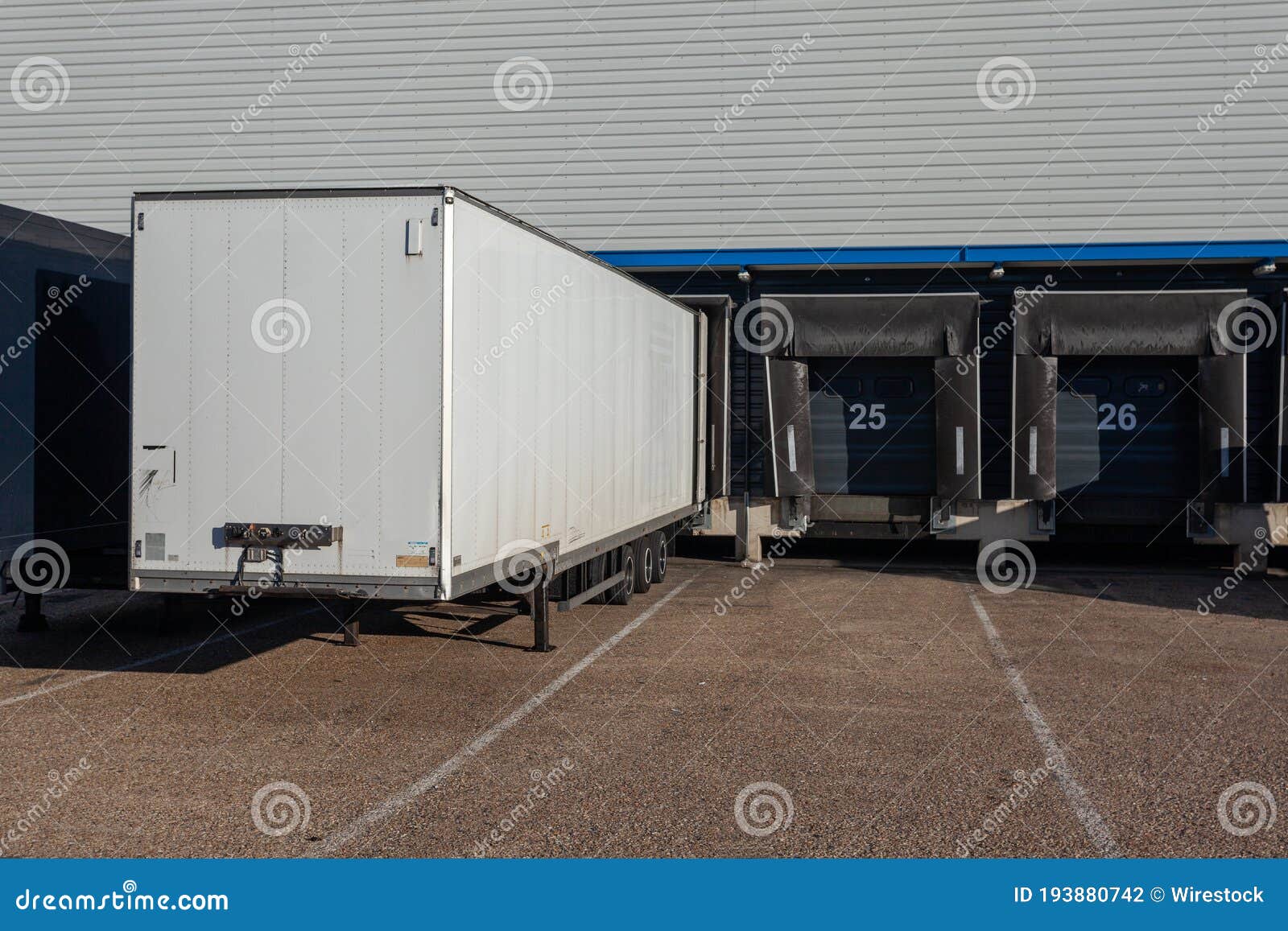 View of Trailers in Front of Loading Doors at a Warehouse Stock Photo ...