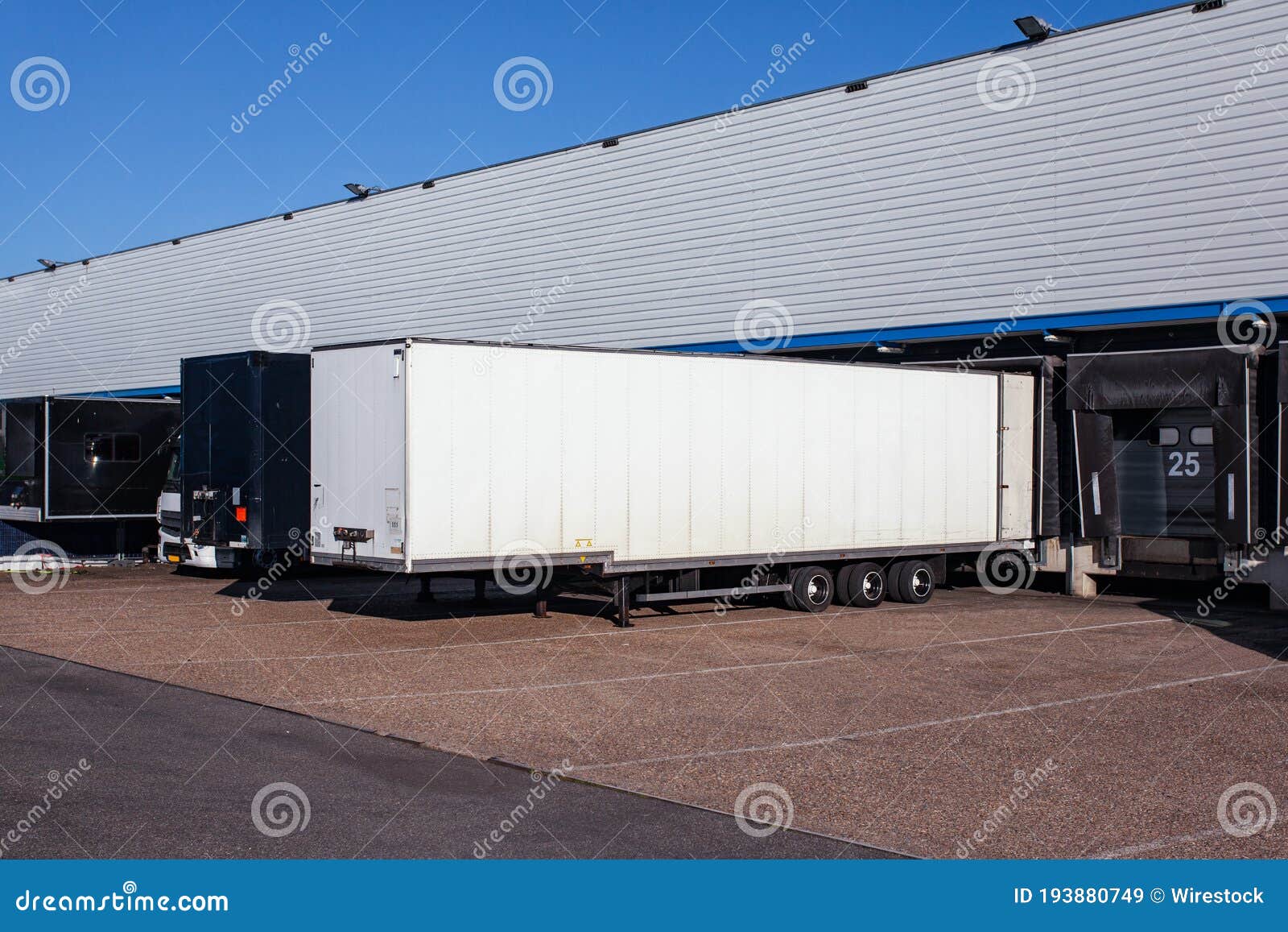 View of Trailers in Front of Loading Doors at a Warehouse Stock Image ...