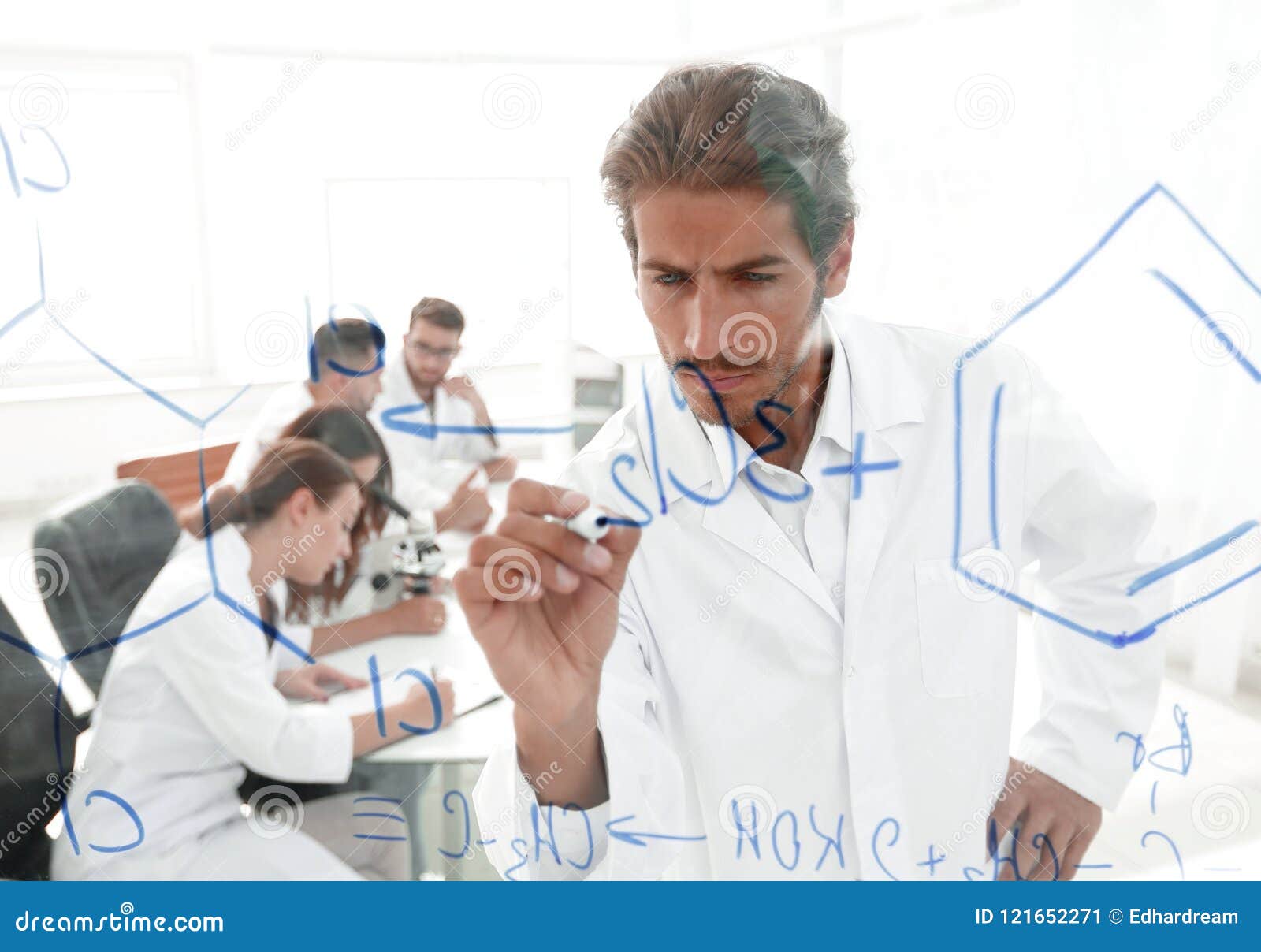View through the Transparent Board. Scientist Writes on the Board Stock ...