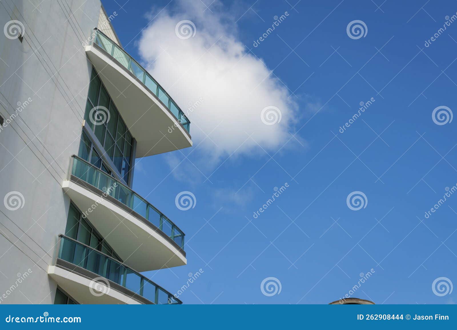 View of Triangular Balconies with Glass Railings from Below at Miami ...