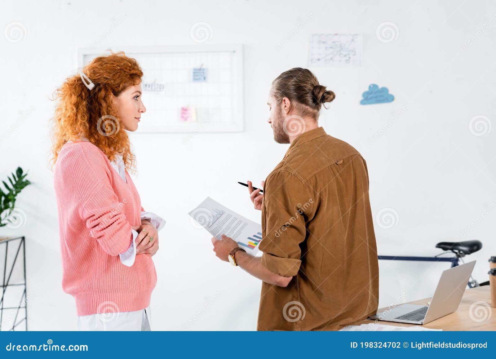 View of Two Friends Talking and Doing Paperwork in Office Stock Photo ...