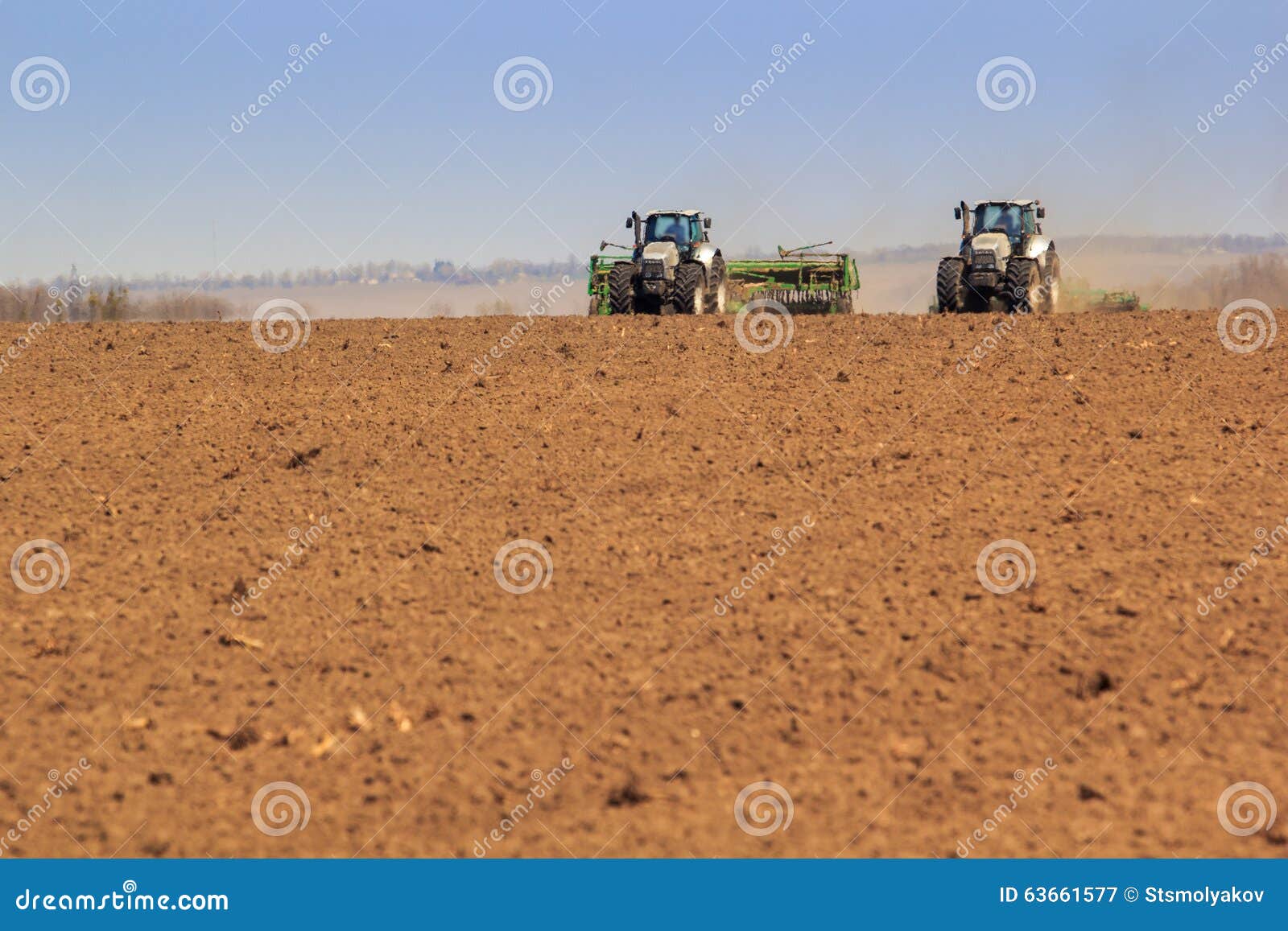View of Two Tractors Sowing in Field in Spring Stock Image - Image of ...