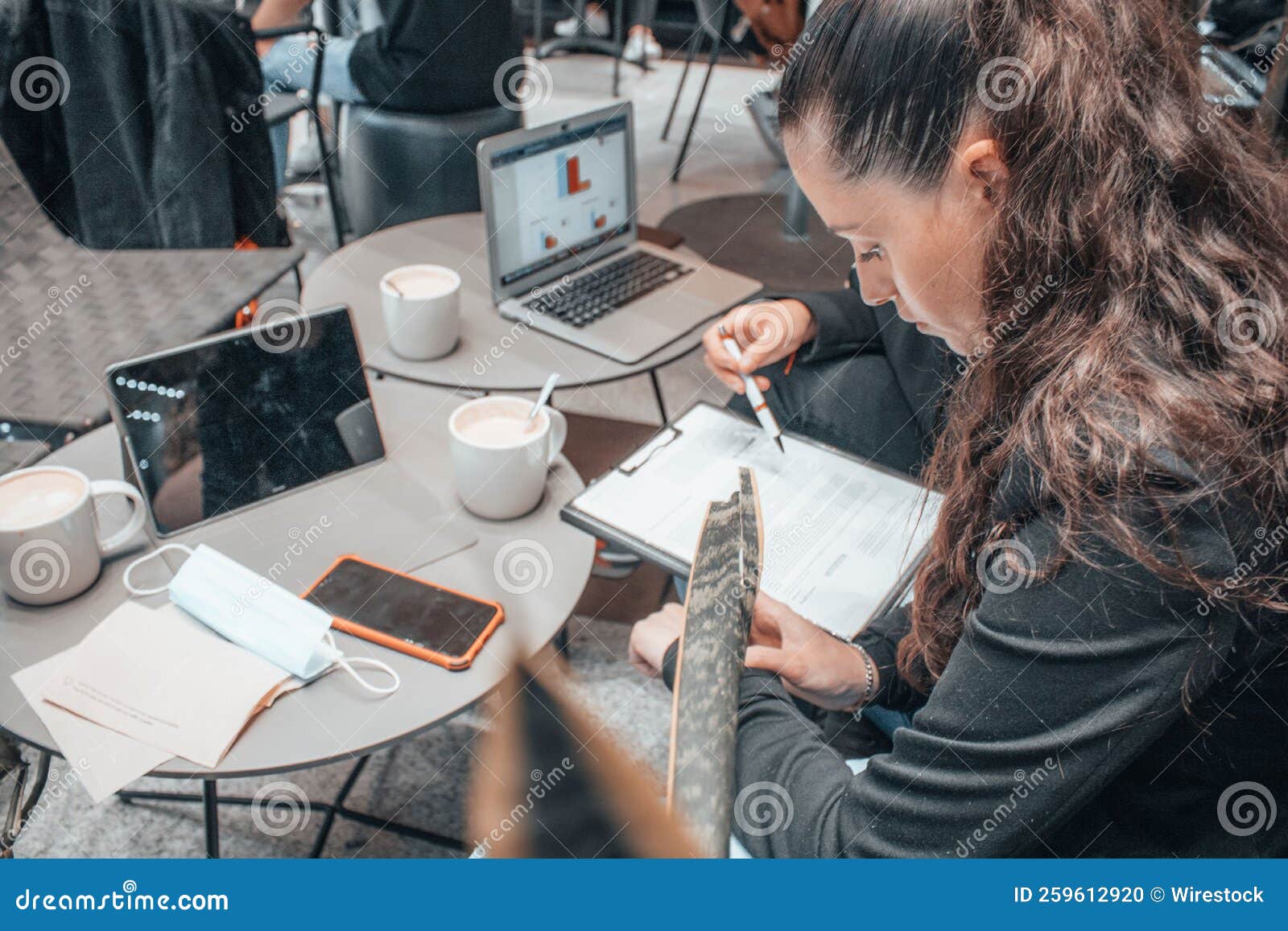 View of Two Young Interns Working on a Task while Sitting in the ...