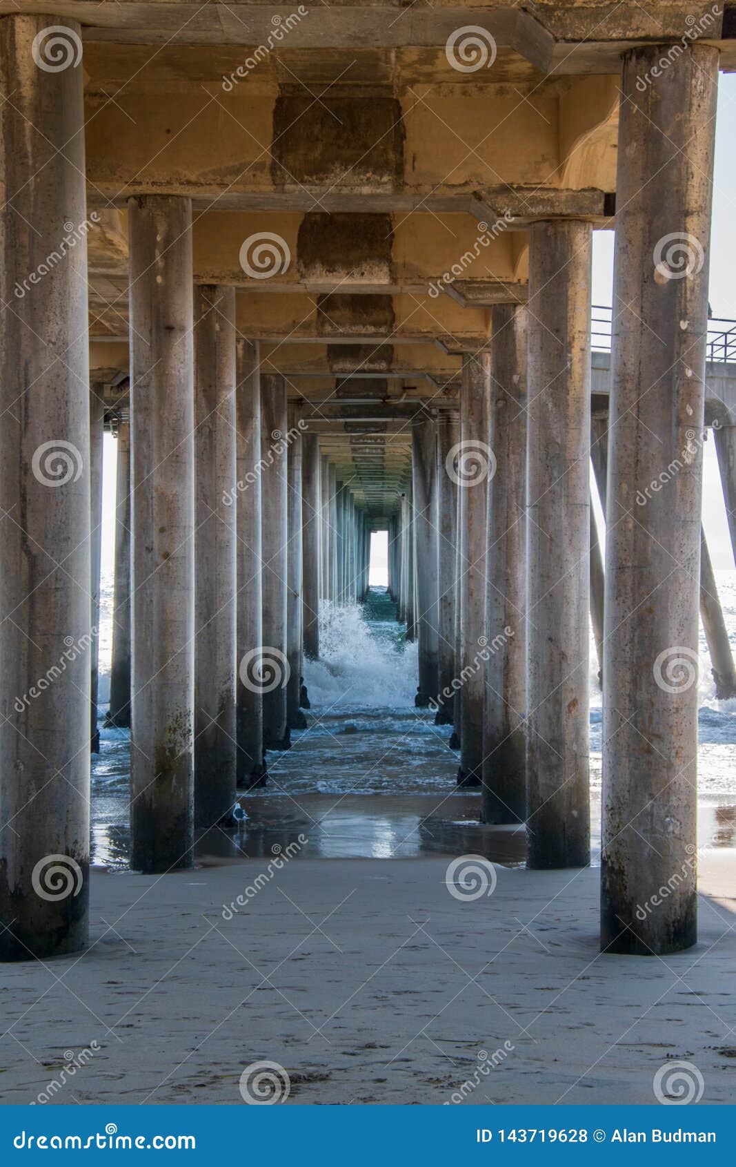 Concrete Pillars Underneath a Long Pier on the Beach Stock Photo ...