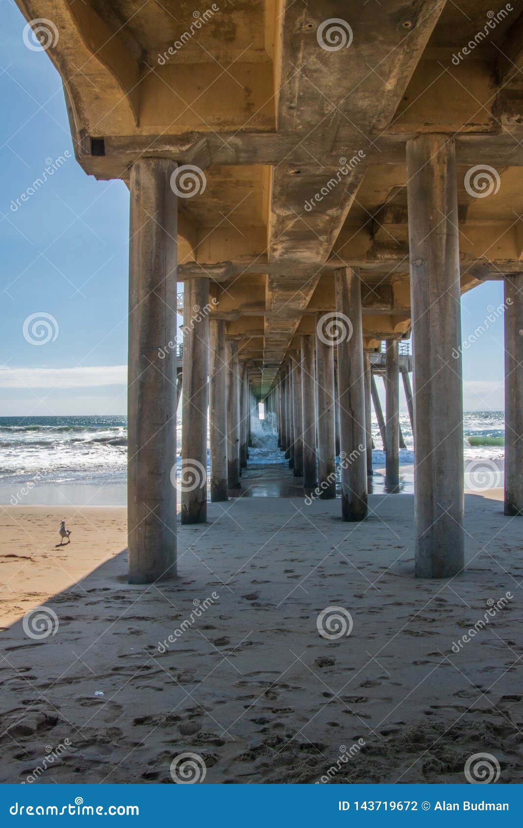 Concrete Pillars Underneath a Long Pier on the Beach Stock Photo ...
