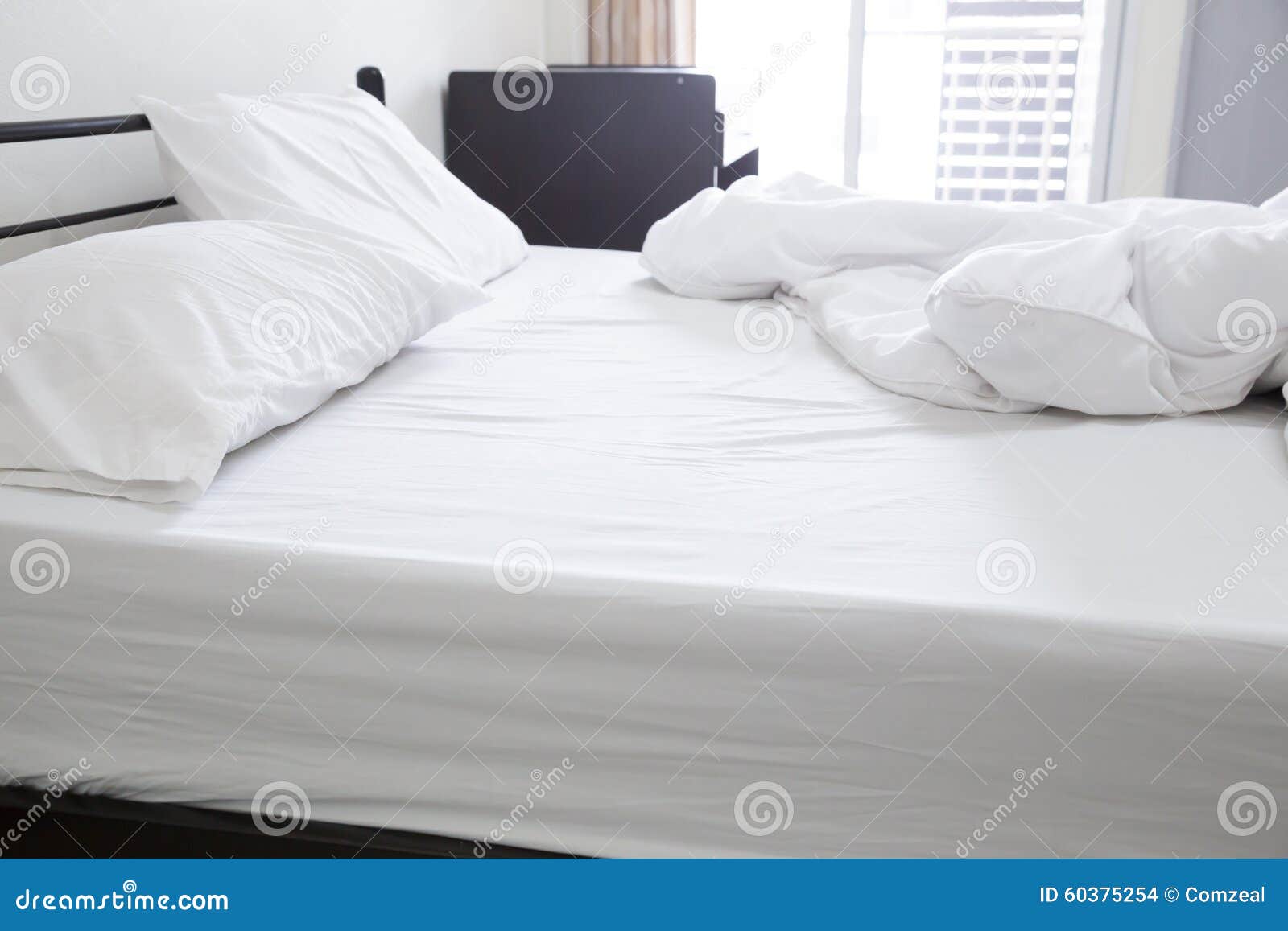 View of an unmade bed stock photo. Image of comfort, room - 60375254