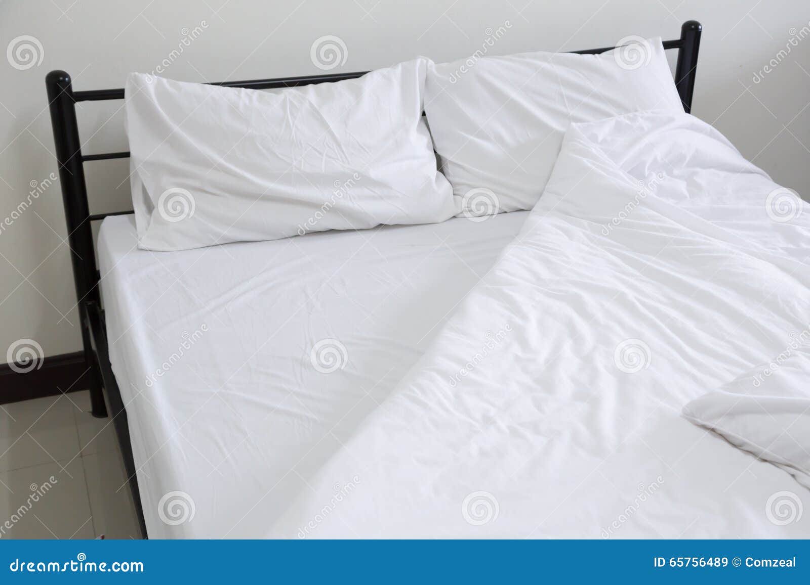 View of an unmade bed stock image. Image of comfort, white - 65756489