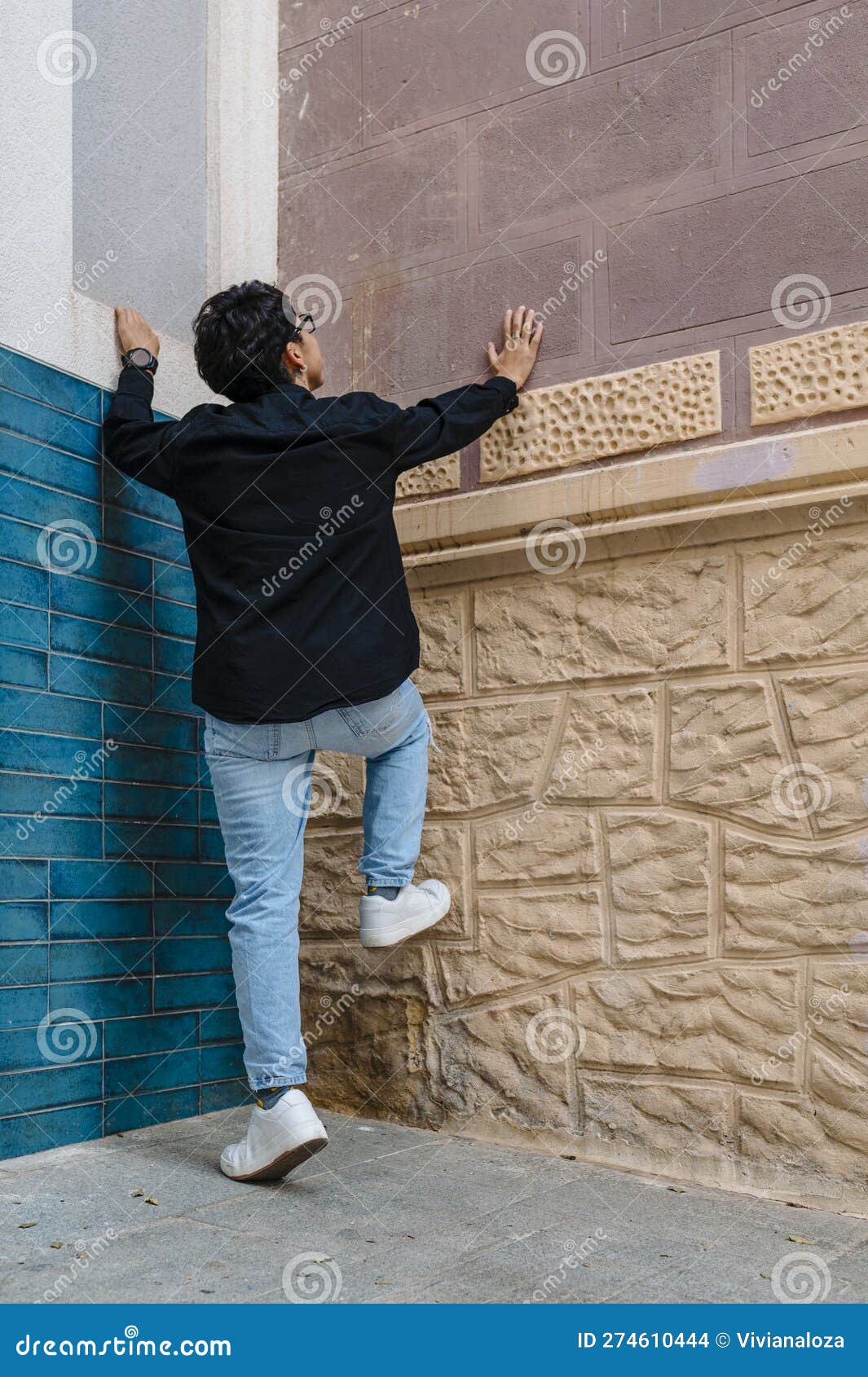 Unrecognizable Person Hanging on the Walls Outdoors. Stock Photo ...