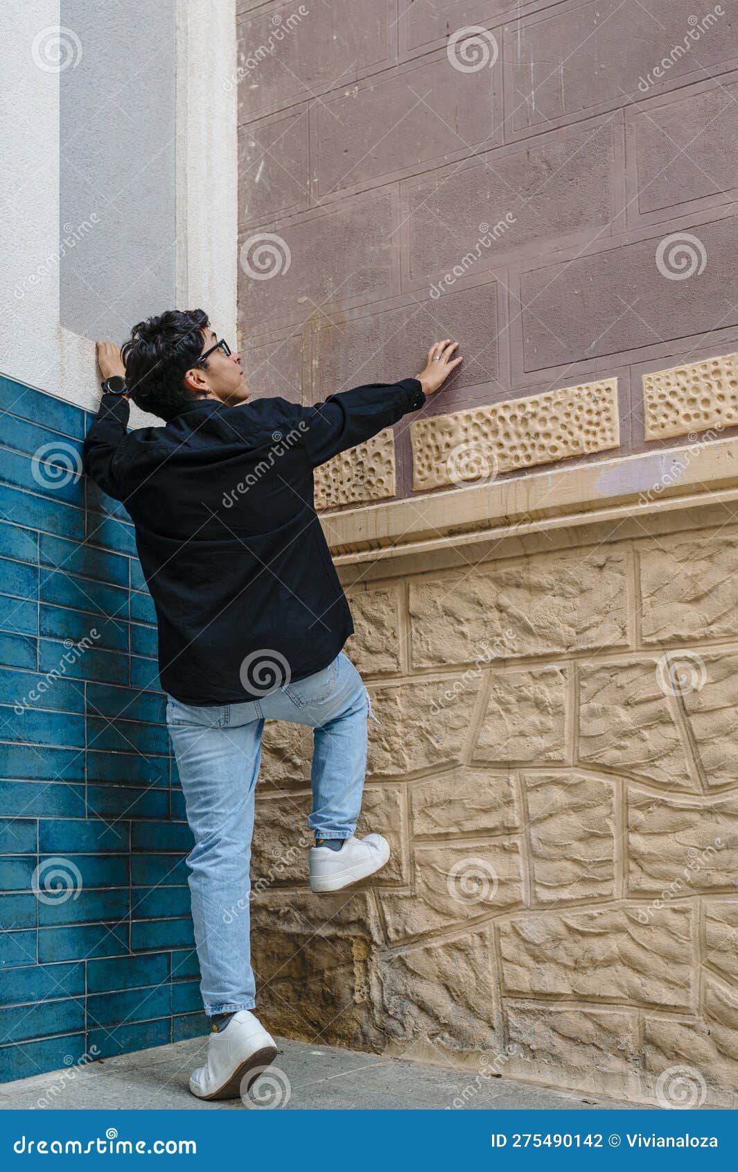 Unrecognizable Person Hanging on the Walls Outdoors. Stock Photo ...