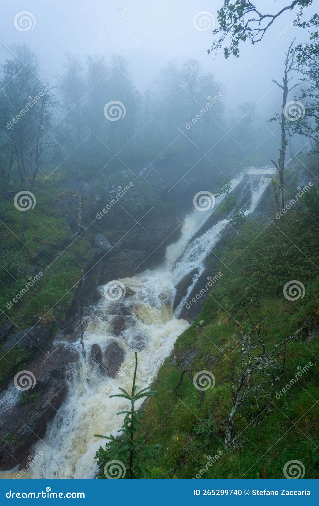 View of the Voringfossen Waterfall in the Deep Fog, Norway Stock Photo ...