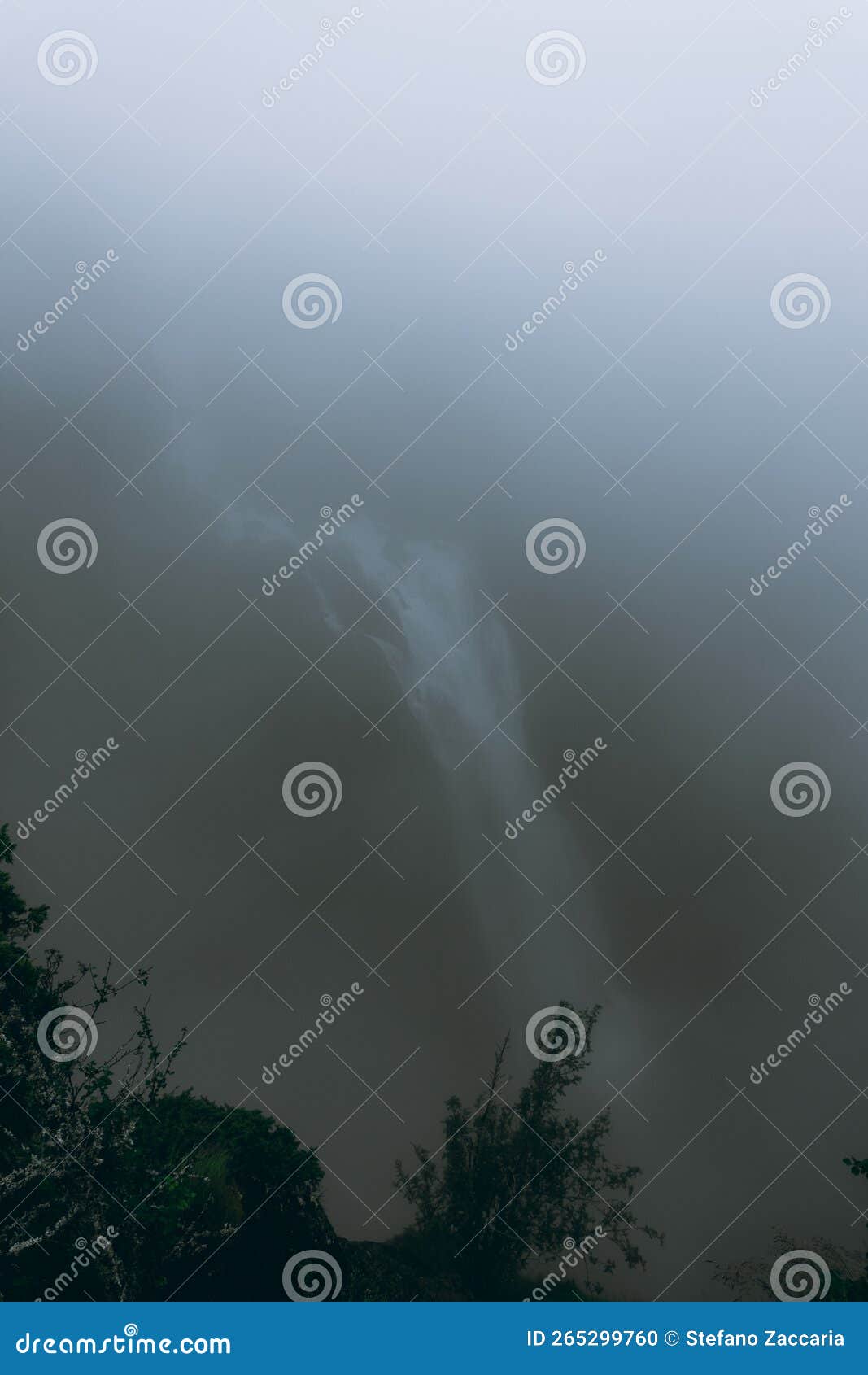 View of the Voringfossen Waterfall in the Deep Fog, Norway Stock Photo ...