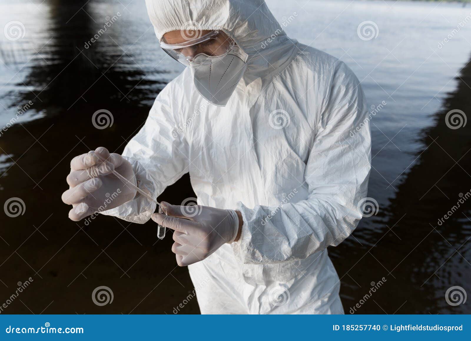 View of Water Inspector in Respirator and Goggles Taking Water Sample ...
