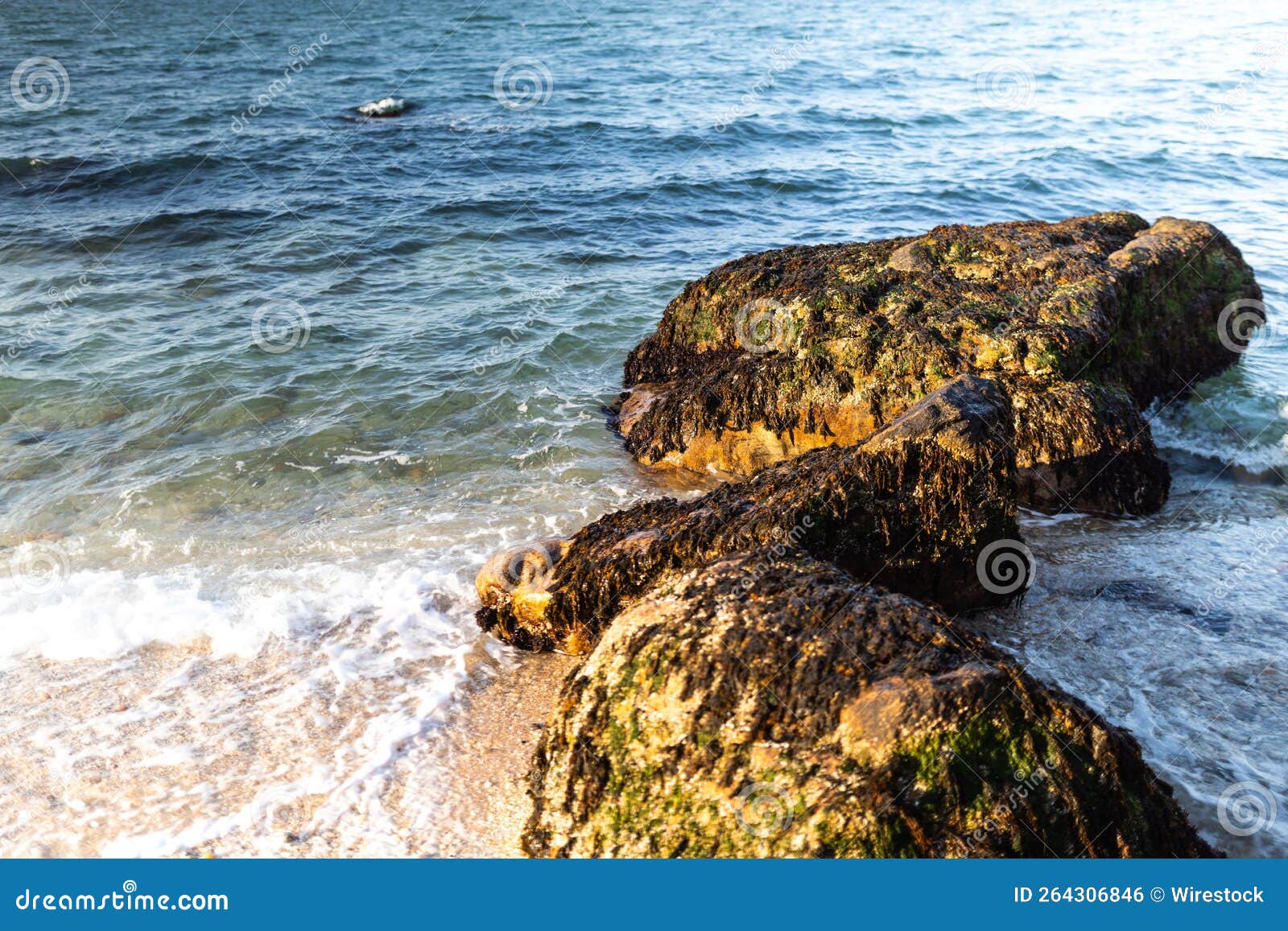 View of Weathered Rocks in Wavy Blue Sea Stock Photo - Image of blue ...