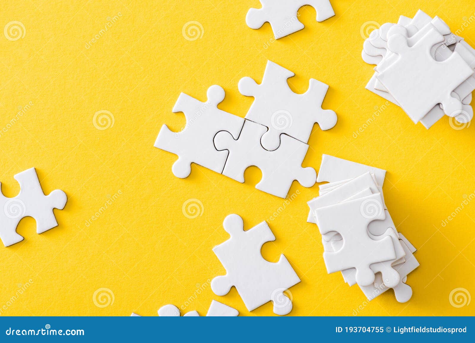 View of White Stack of Jigsaw Near Connected Puzzles Isolated on Yellow ...