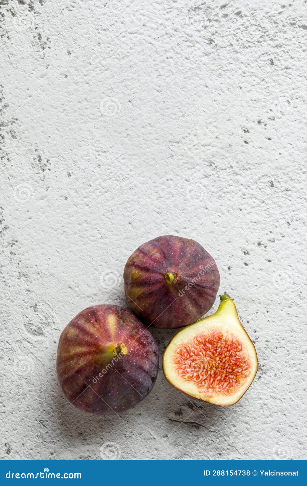 View of Whole and Cut Organic Figs on Stone Table Stock Photo - Image ...
