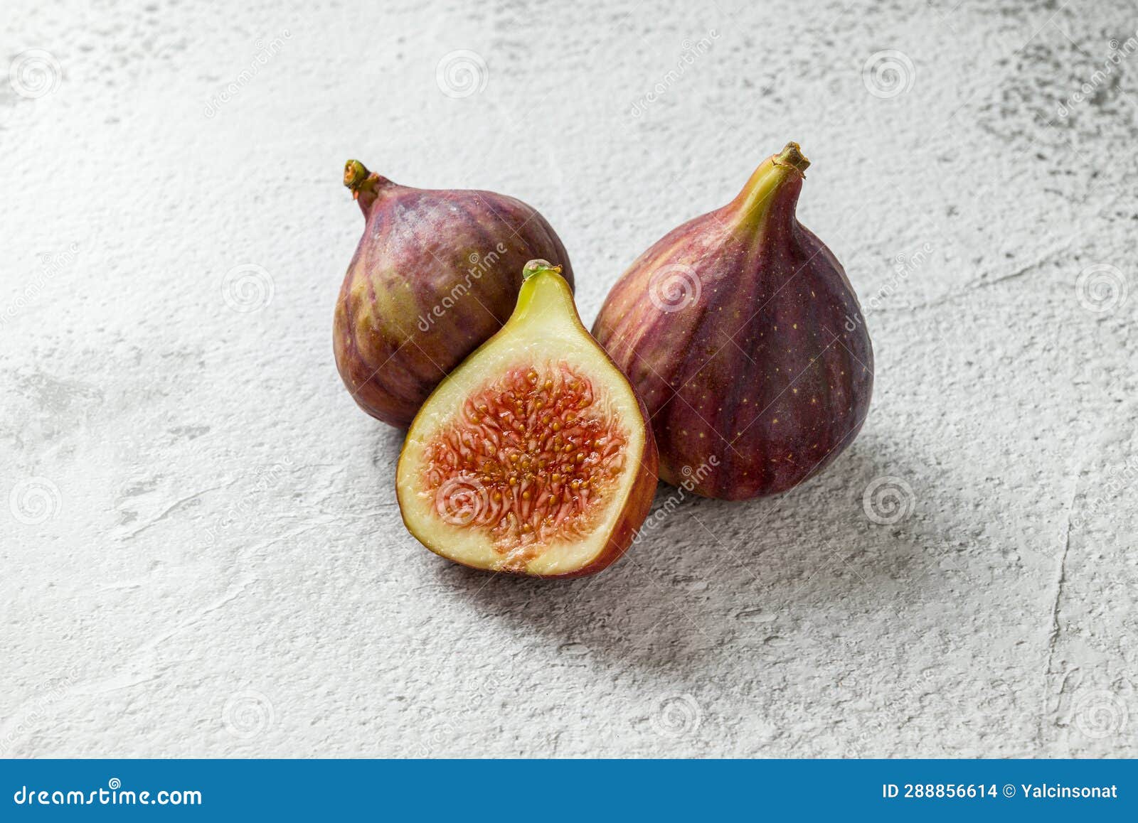 View of Whole and Cut Organic Figs on Stone Table Stock Photo - Image ...