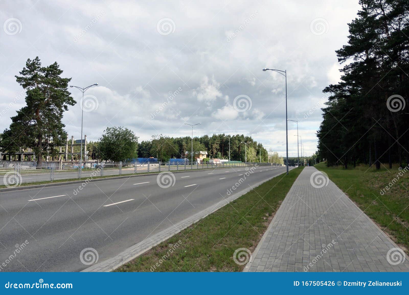 View of a Wide Empty Road with Trees on the Side of the Road Stock ...